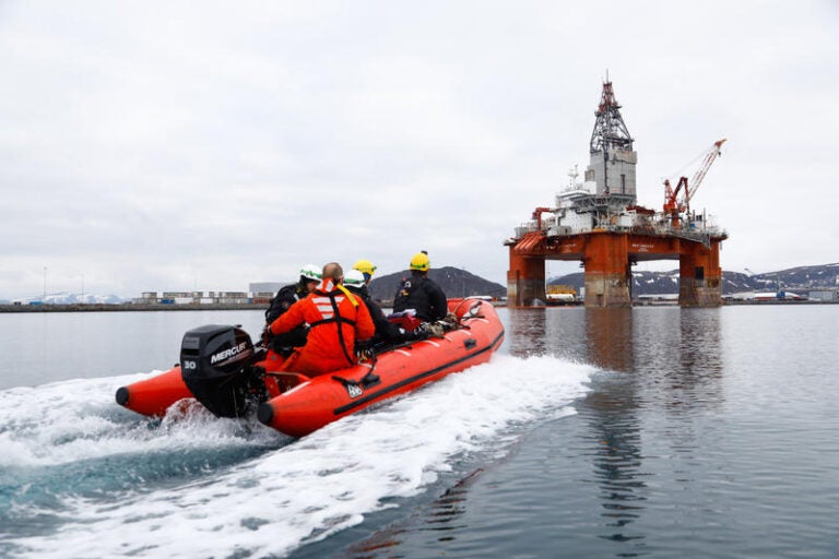 Greenpeace activists climb aboard oil rig to protest Arctic drilling